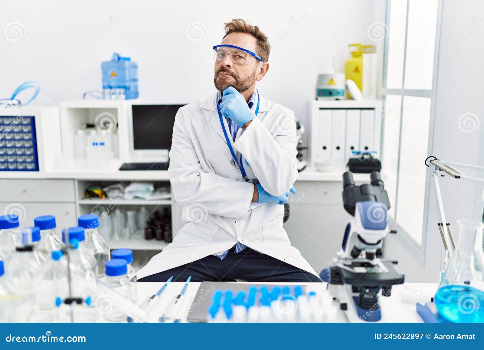 Middle Age Man Working at Scientist Laboratory Serious Face Thinking ...