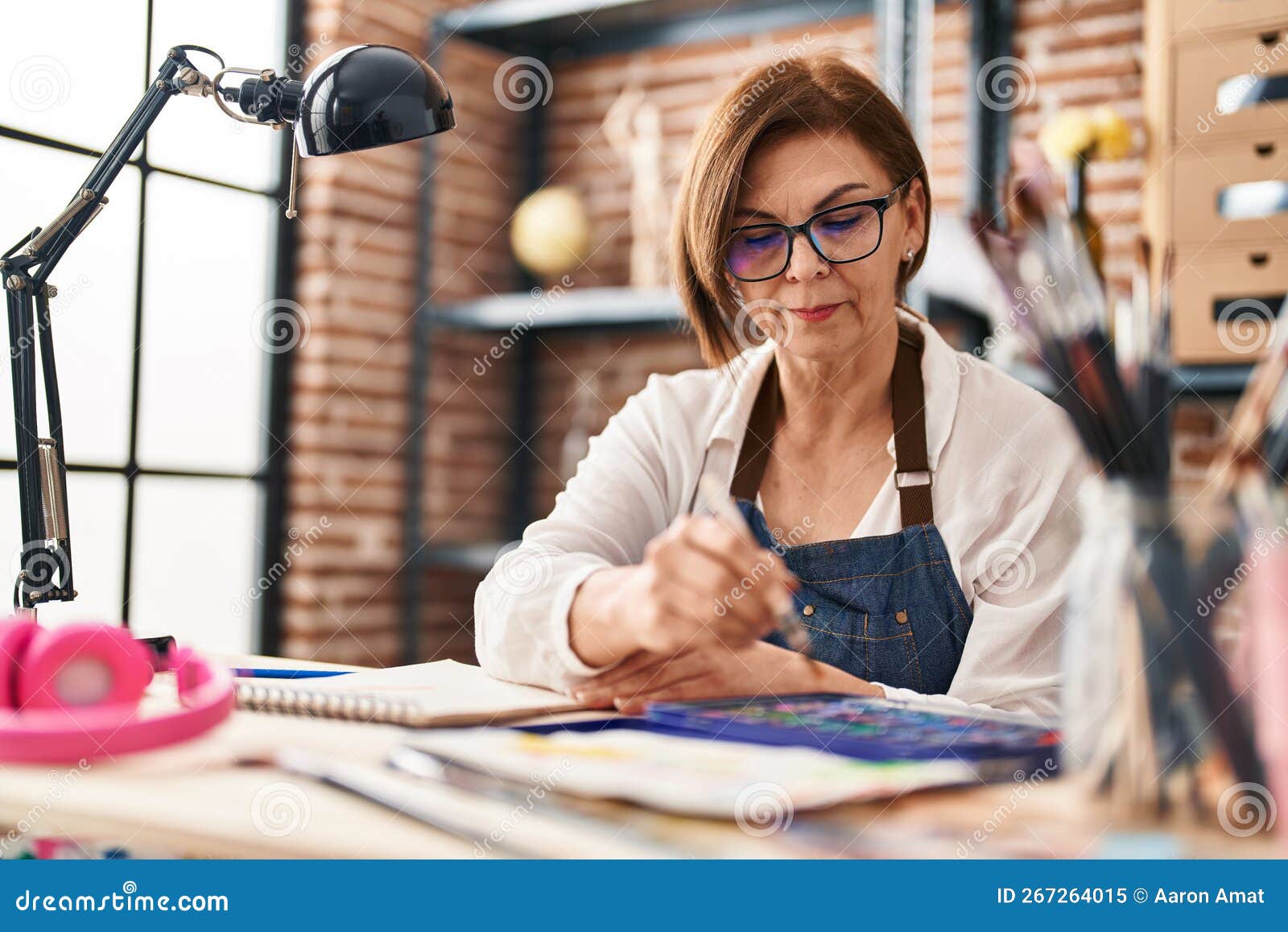 Middle Age Woman Artist Drawing on Notebook at Art Studio Stock Image ...