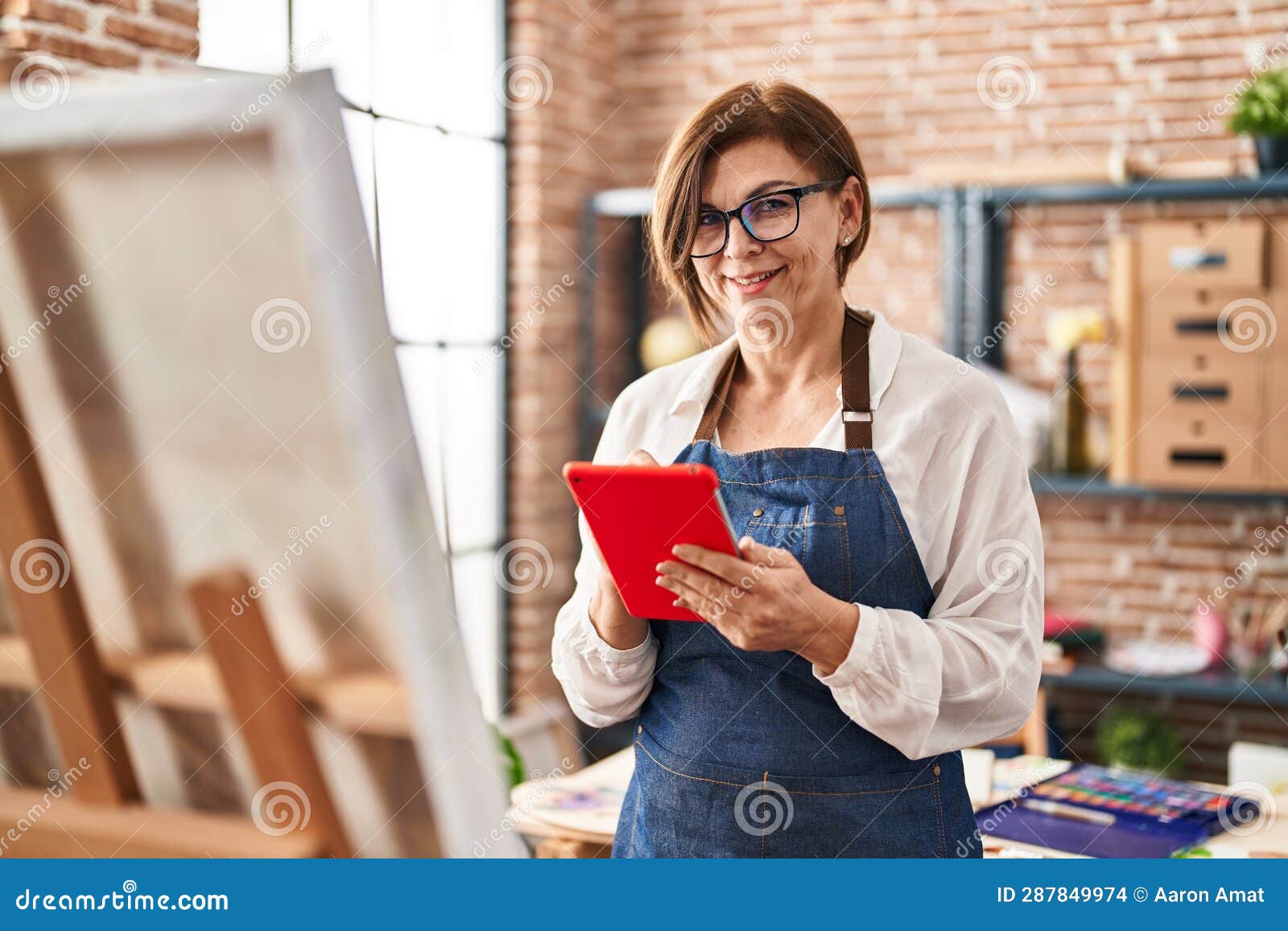 Middle Age Woman Artist Using Touchpad Drawing at Art Studio Stock ...