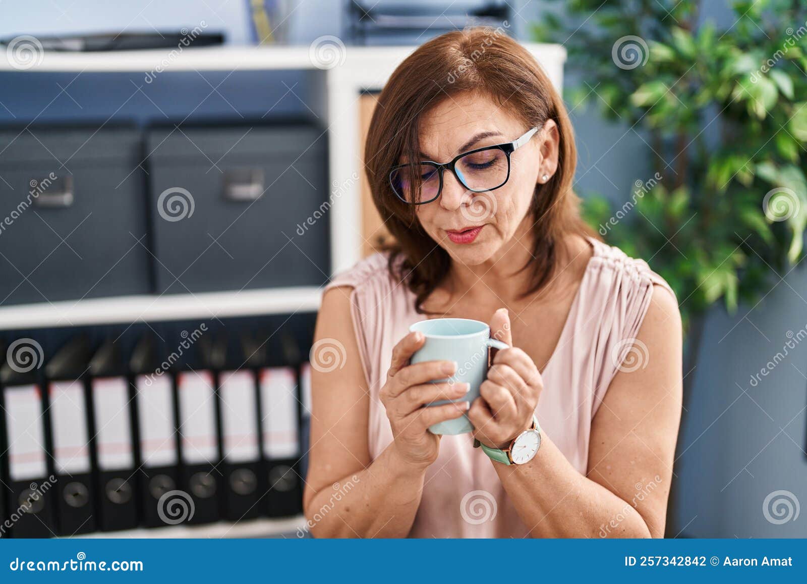 Middle Age Woman Business Worker Drinking Coffee at Office Stock Photo ...