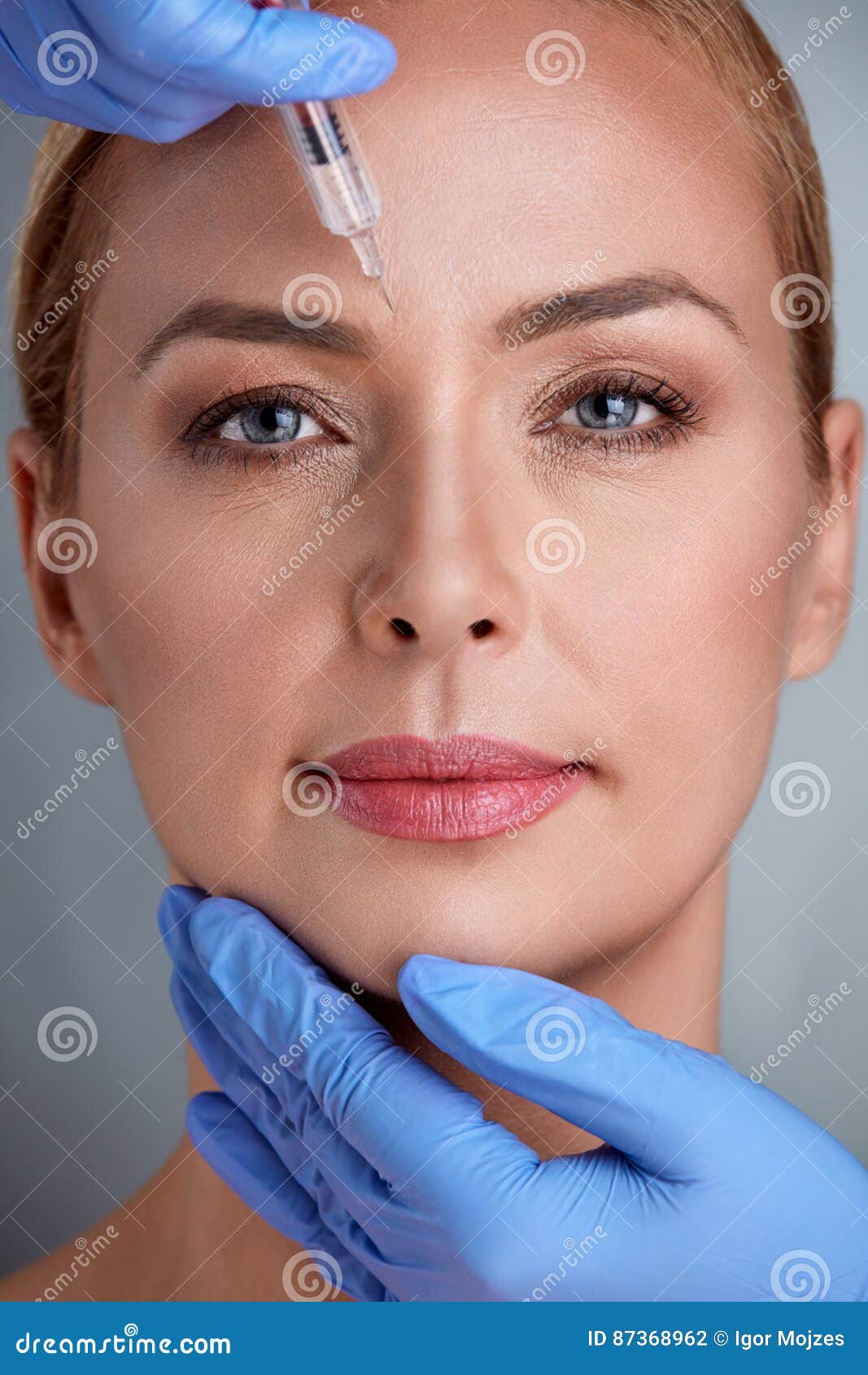 Middle Age Woman Getting Cosmetic Injection in Forehead Stock Photo ...