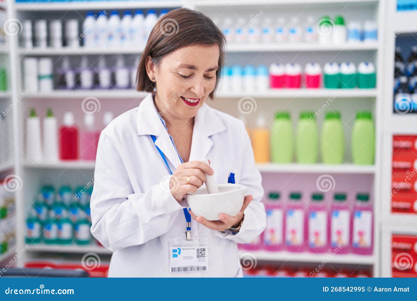 Middle Age Woman Pharmacist Smiling Confident Make Mixture at Pharmacy ...