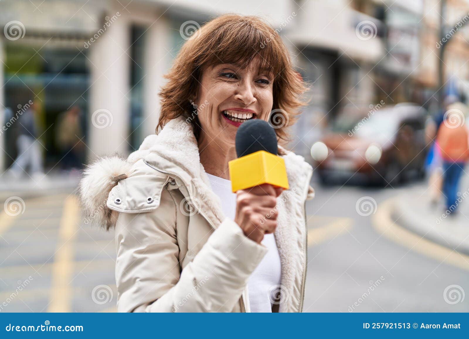 Middle Age Woman Reporter Working Using Microphone at Street Stock ...