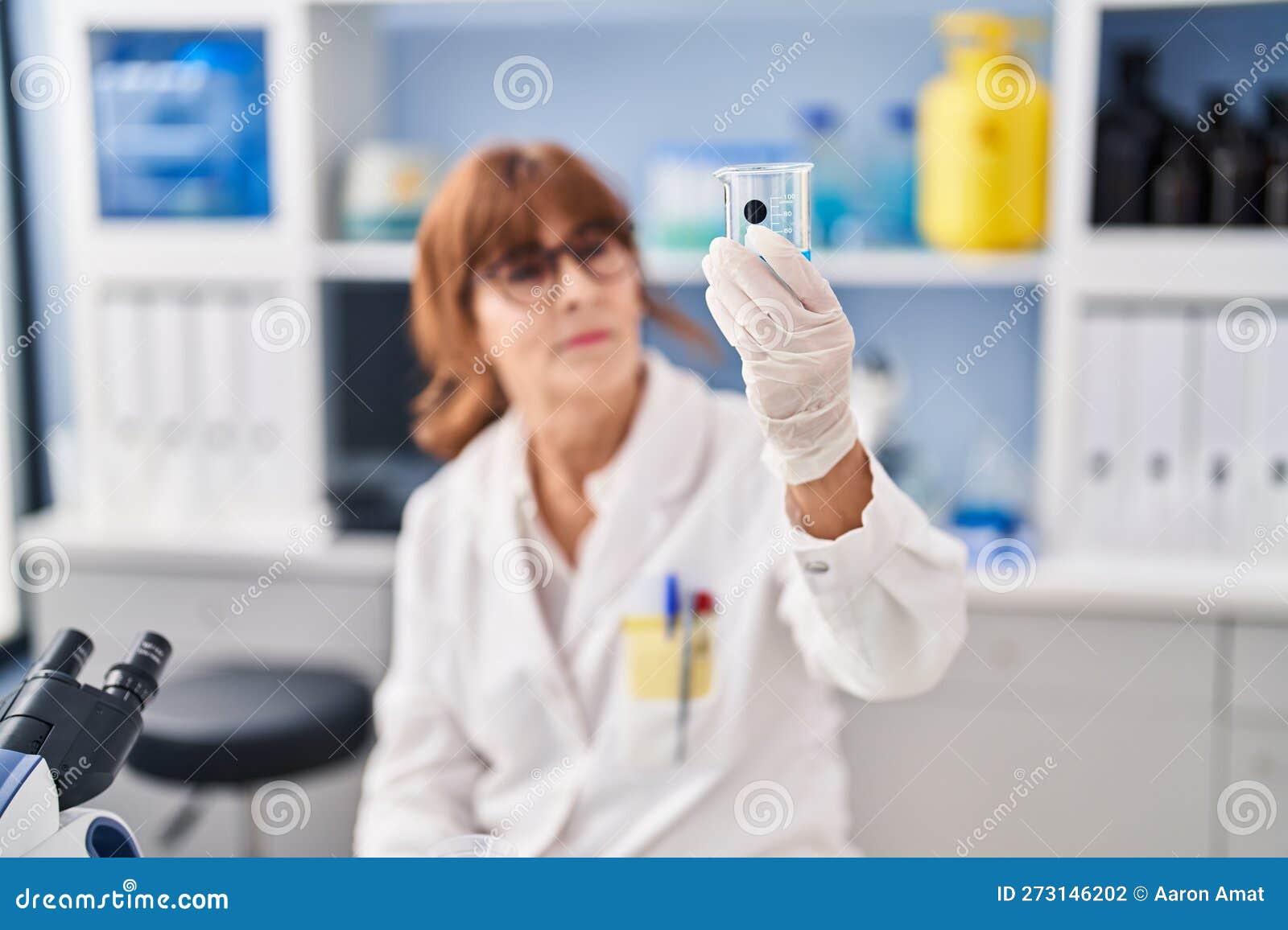 Middle Age Woman Scientist Looking Sample at Laboratory Stock Photo ...