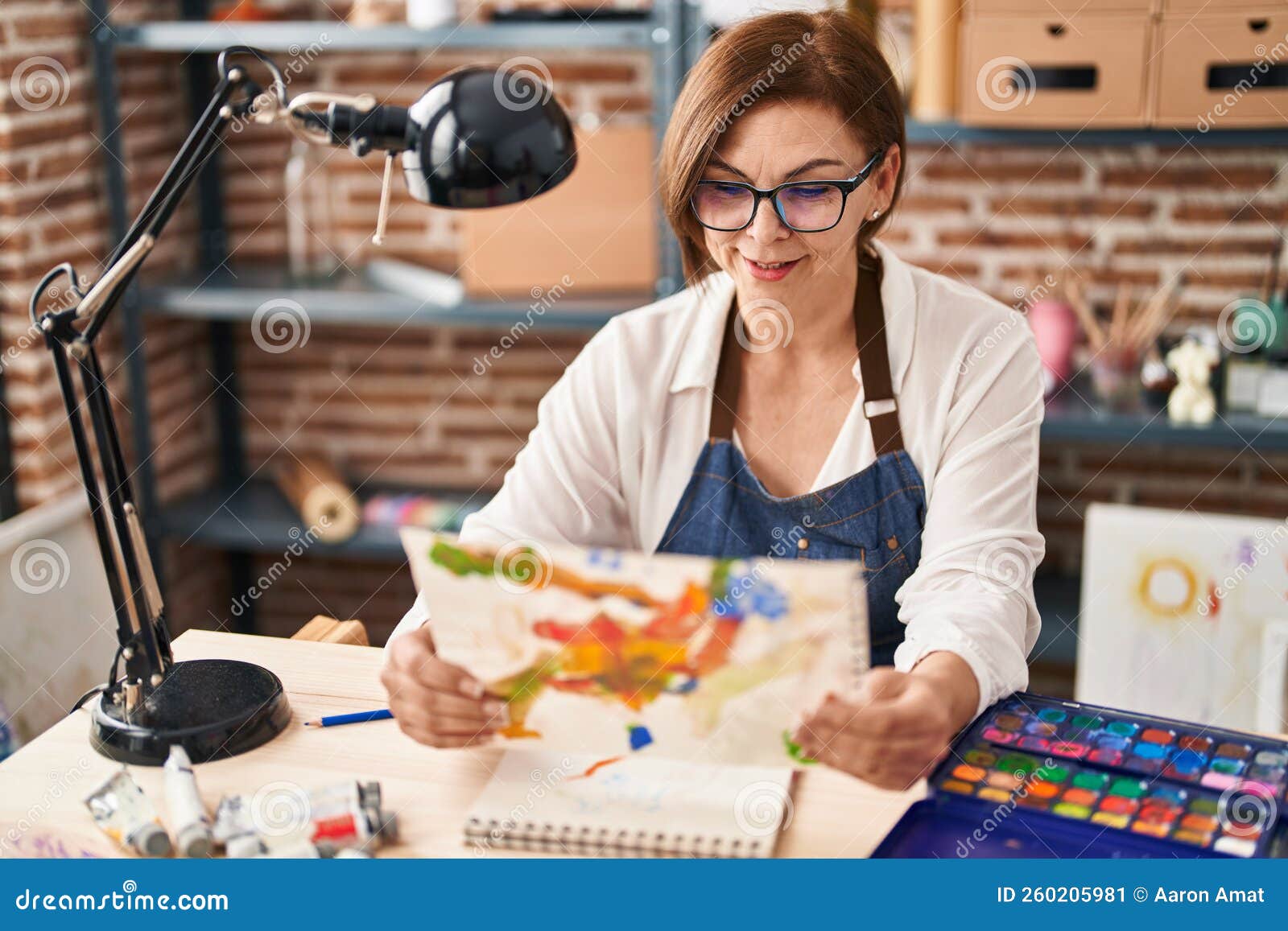 Middle Age Woman Smiling Confident Looking Draw at Art Studio Stock ...
