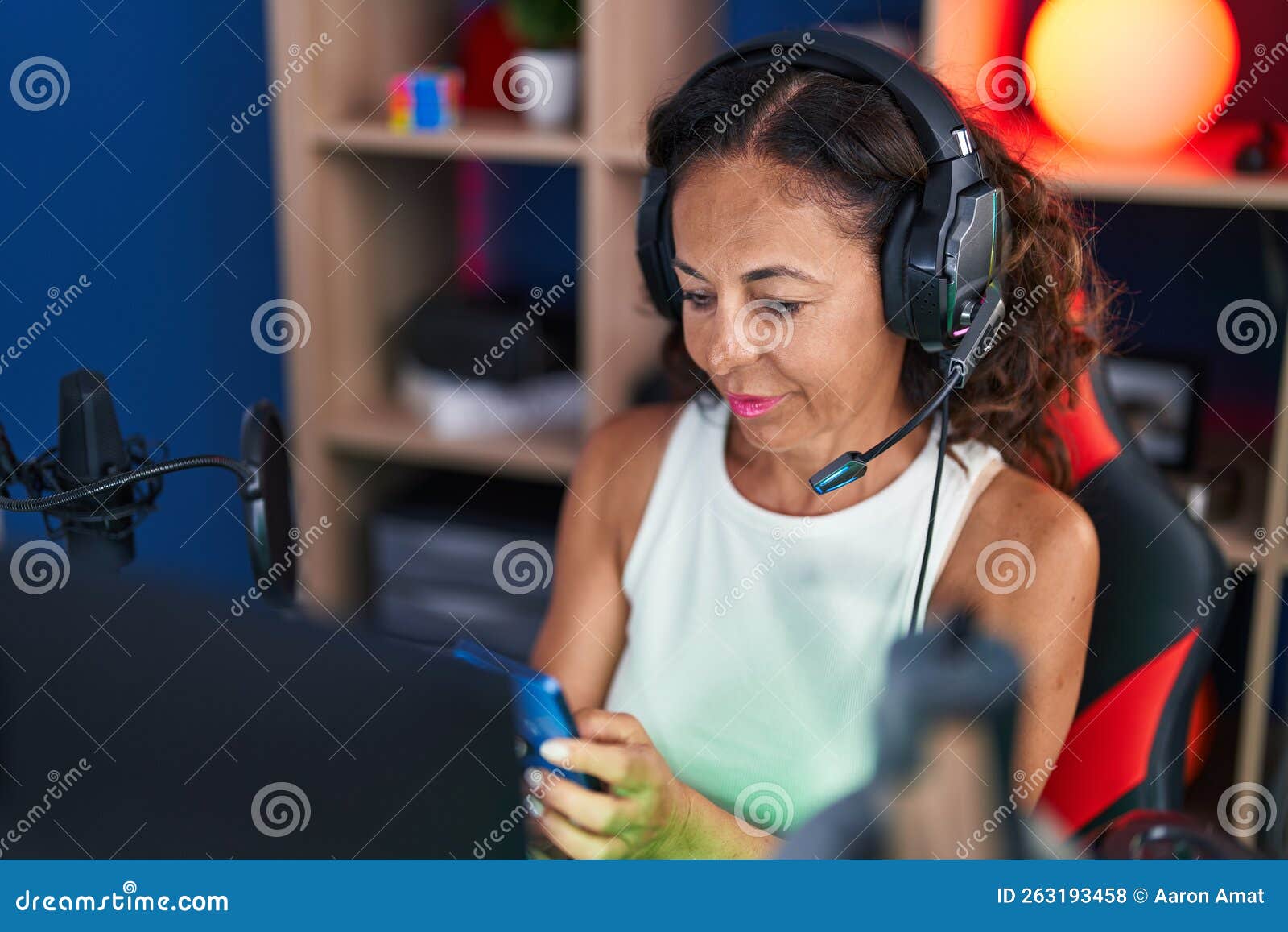 Middle Age Woman Streamer Using Computer and Smartphone at Gaming Room ...