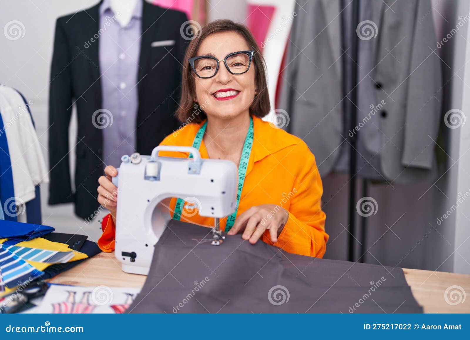 Middle Age Woman Tailor Smiling Confident Using Sewing Machine at ...