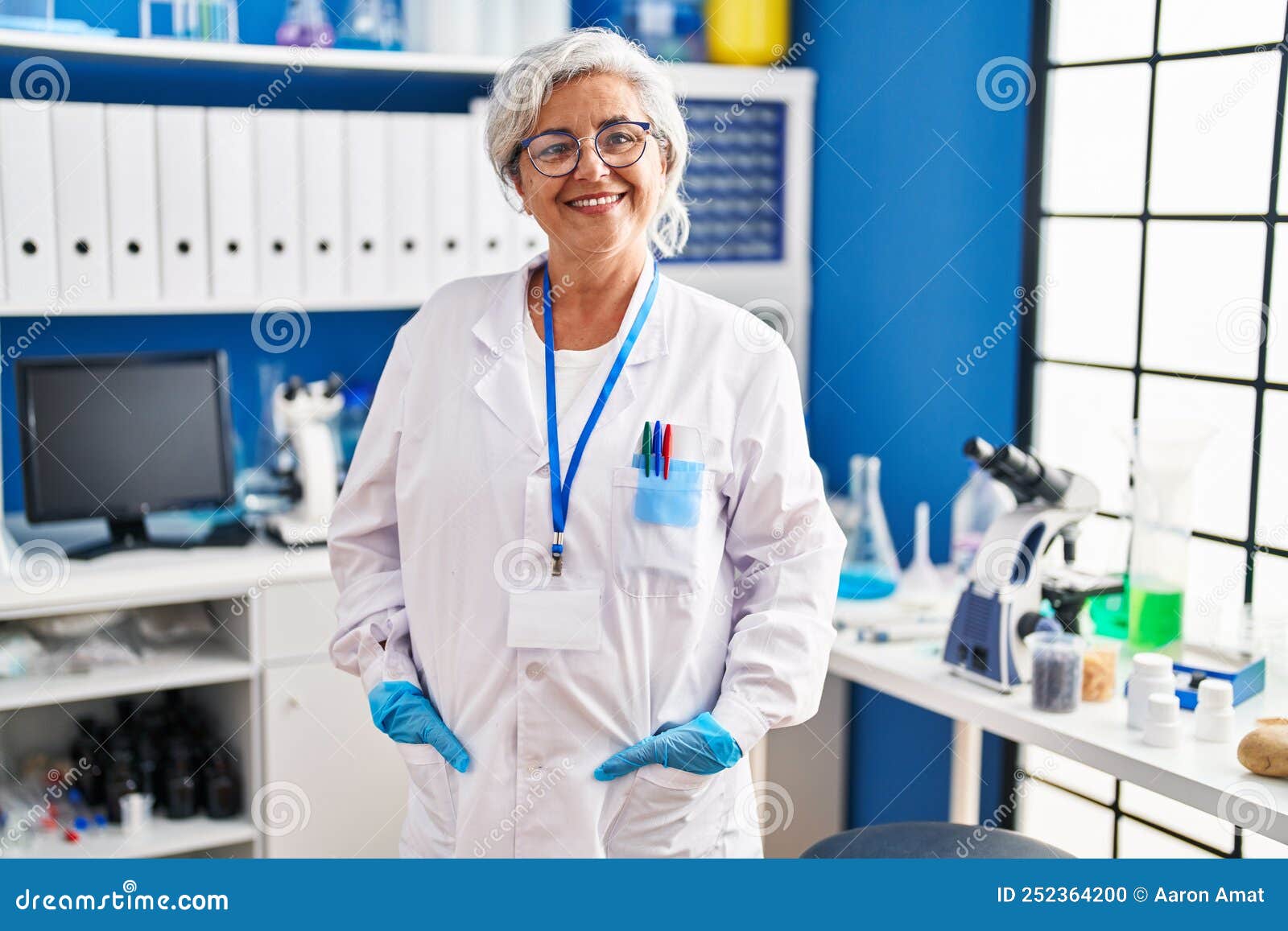Middle Age Woman Wearing Scientist Uniform Standing at Laboratory Stock ...