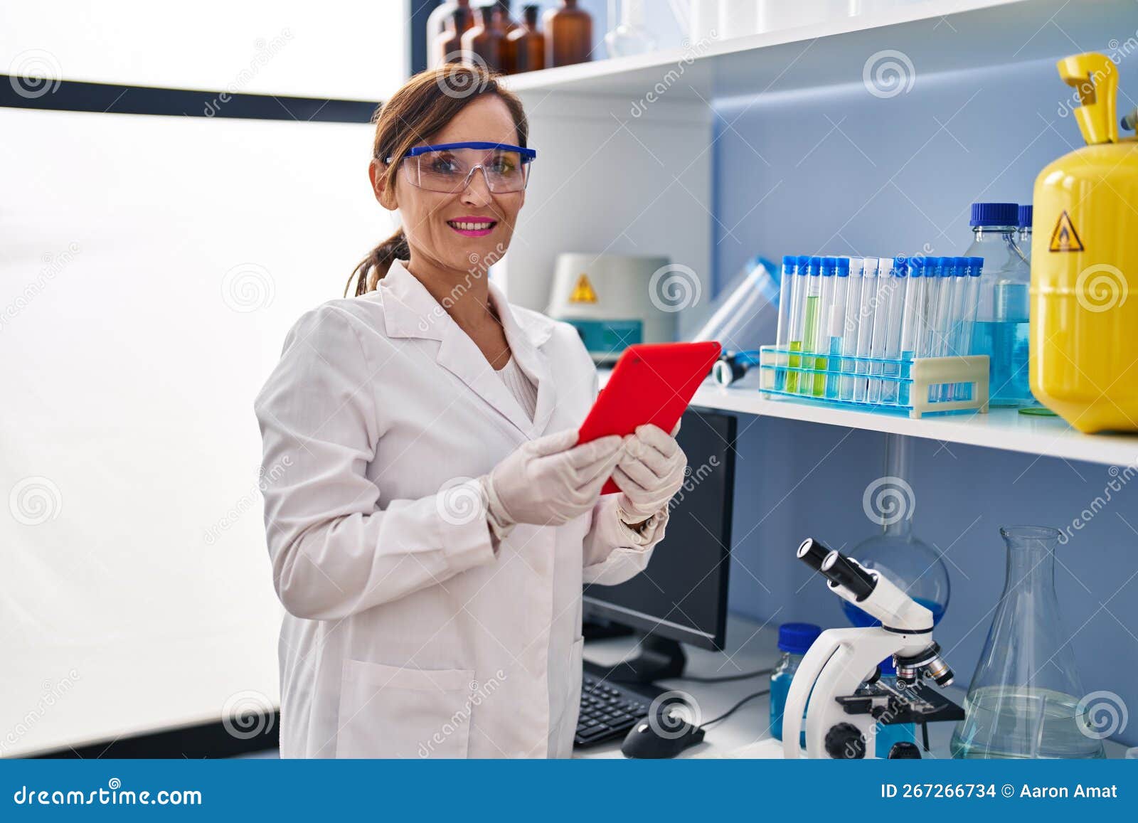 Middle Age Woman Wearing Scientist Uniform Using Touchpad at Laboratory ...