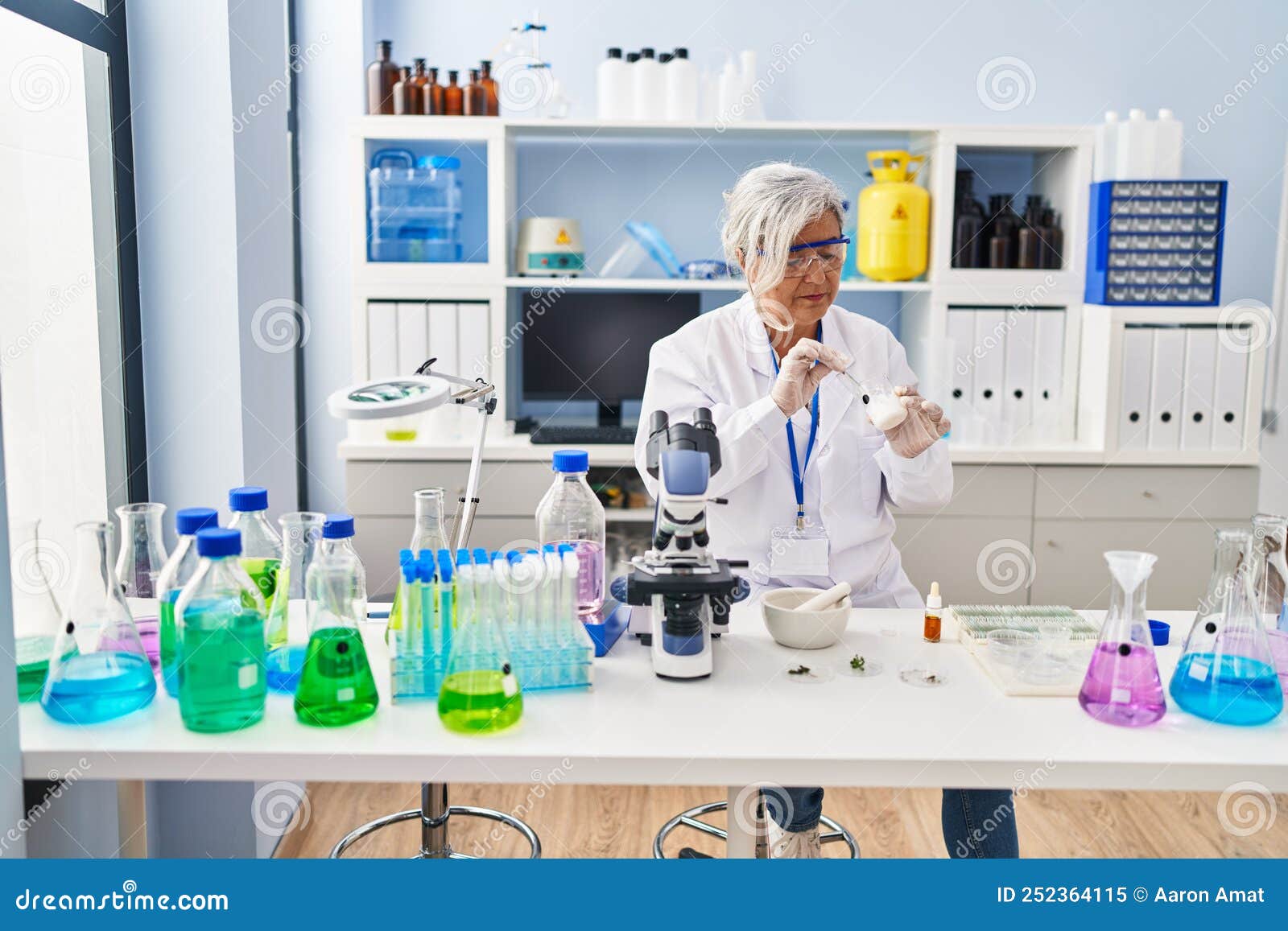 Middle Age Woman Wearing Scientist Uniform Working at Laboratory Stock ...