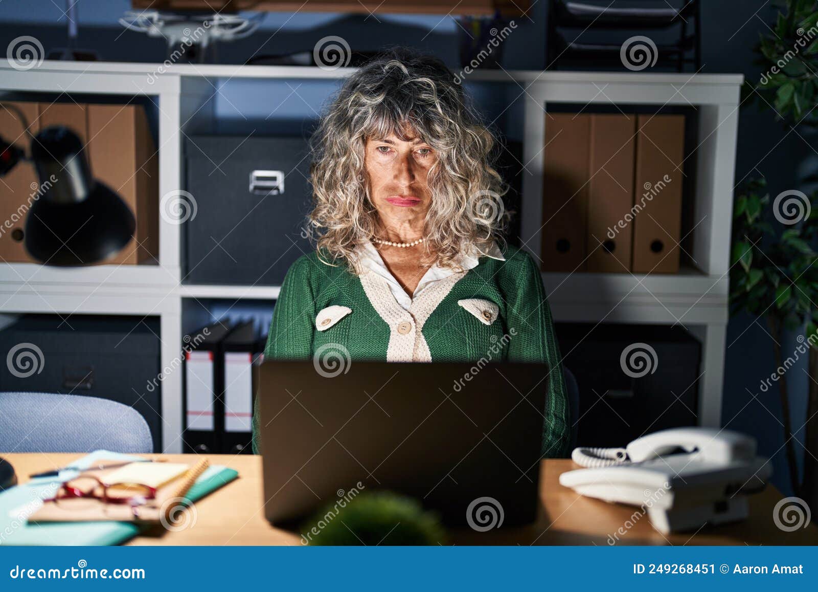 Middle Age Woman Working at Night Using Computer Laptop Depressed and ...