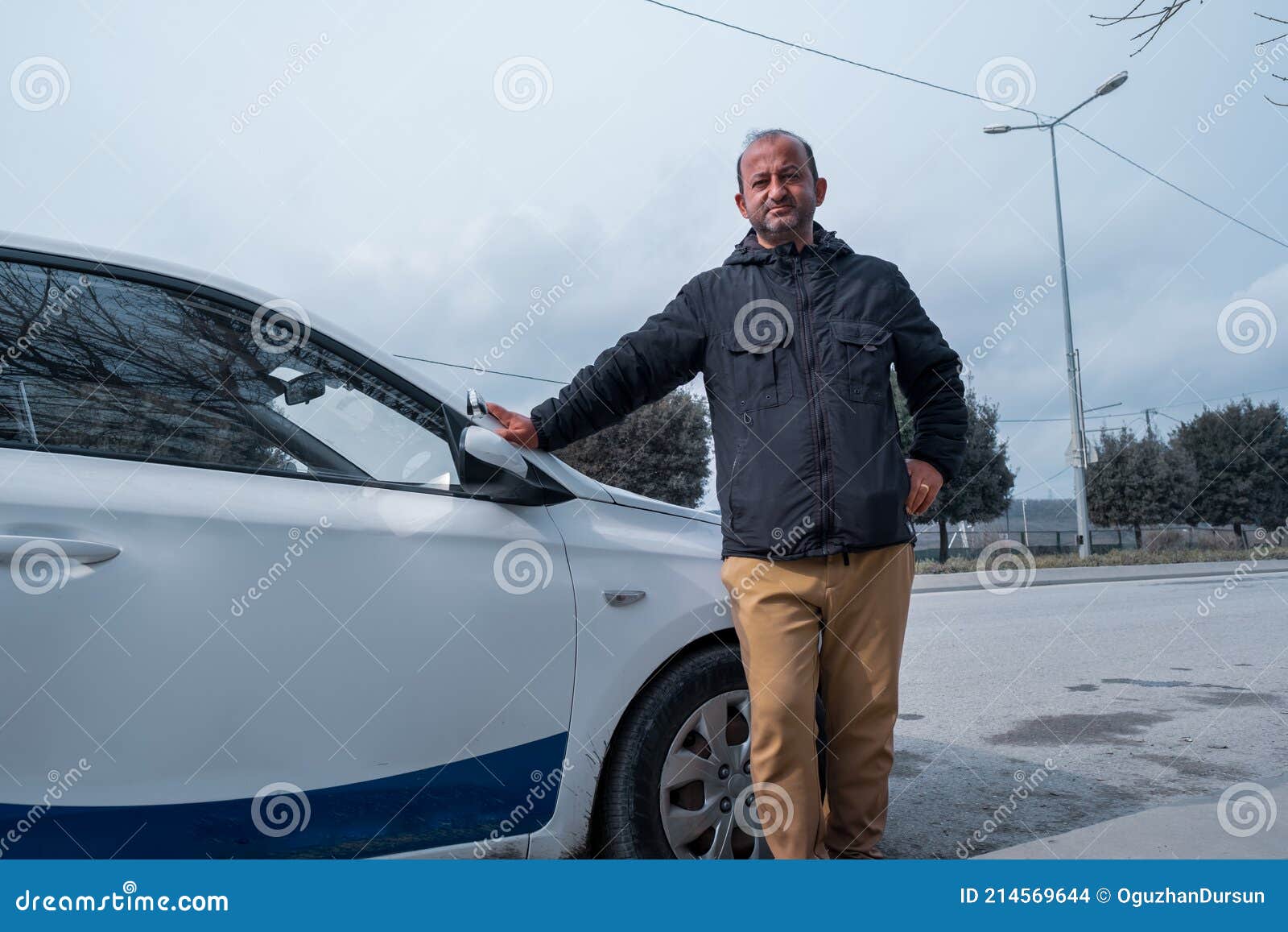 Middle Aged Bald Man Driver Standing in Front of His White Car Outside ...