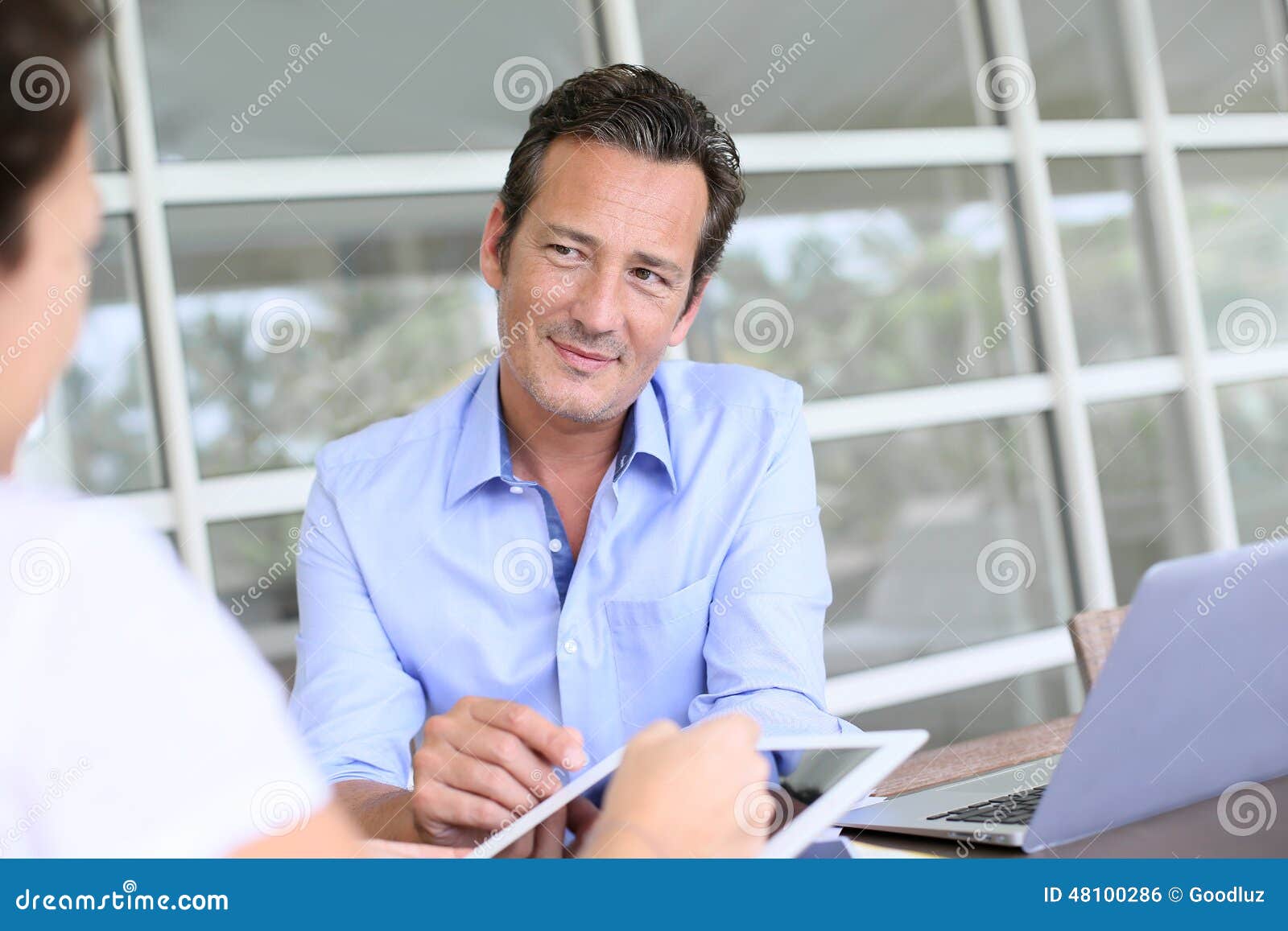 Middle Aged Businessman with a Client in the Office Stock Photo - Image ... Middle Aged Businessman with a Client in the Office Stock Photo - Image ...