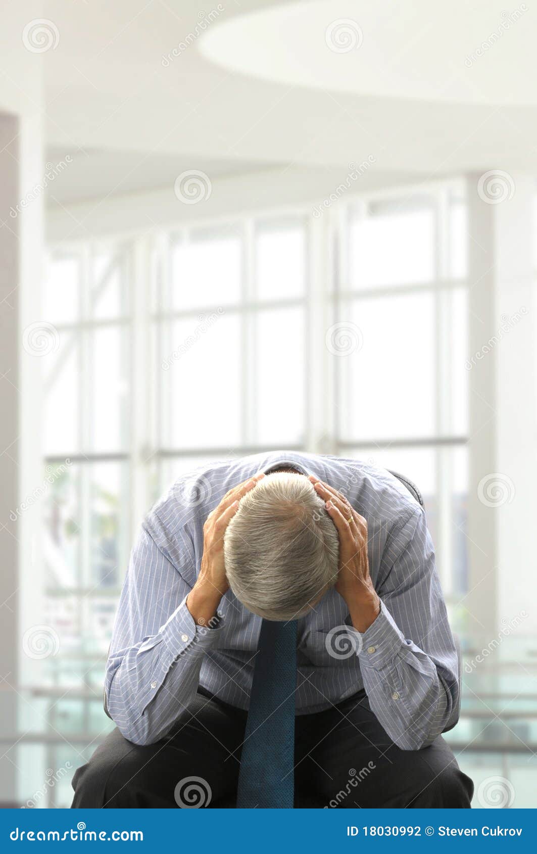 Middle Aged Businessman Doubled Over Head in Hands Stock Photo - Image ...