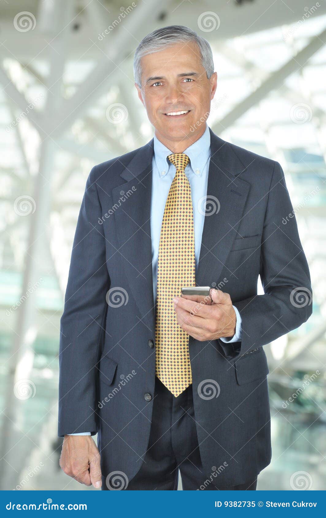 Middle Aged Businessman with Electronic Device Stock Image - Image of ...