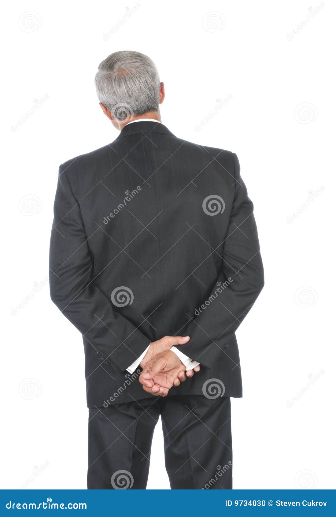 Middle Aged Businessman with Hands Behind Back Stock Photo - Image of ...