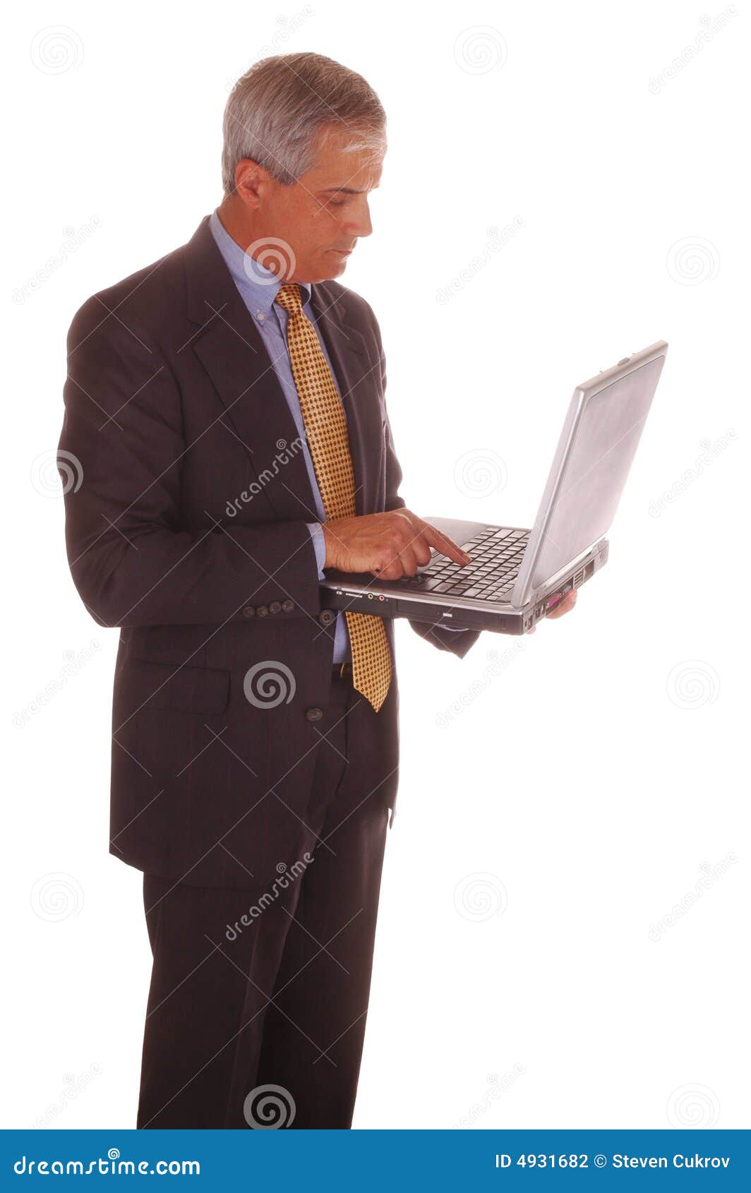 Middle Aged Businessman Holding Computer Stock Photo - Image of ...