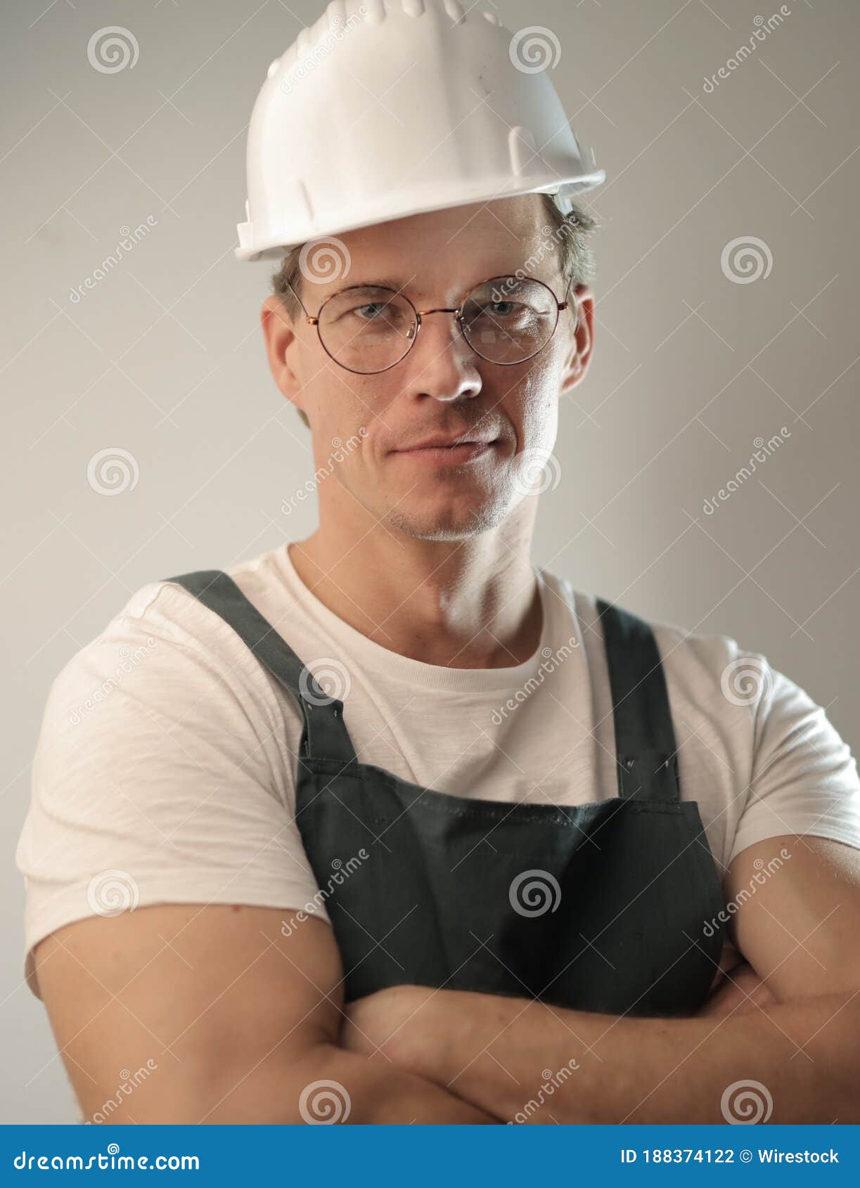 Middle-aged Carpenter Wearing a White Hard Hat and Uniform Against a ...