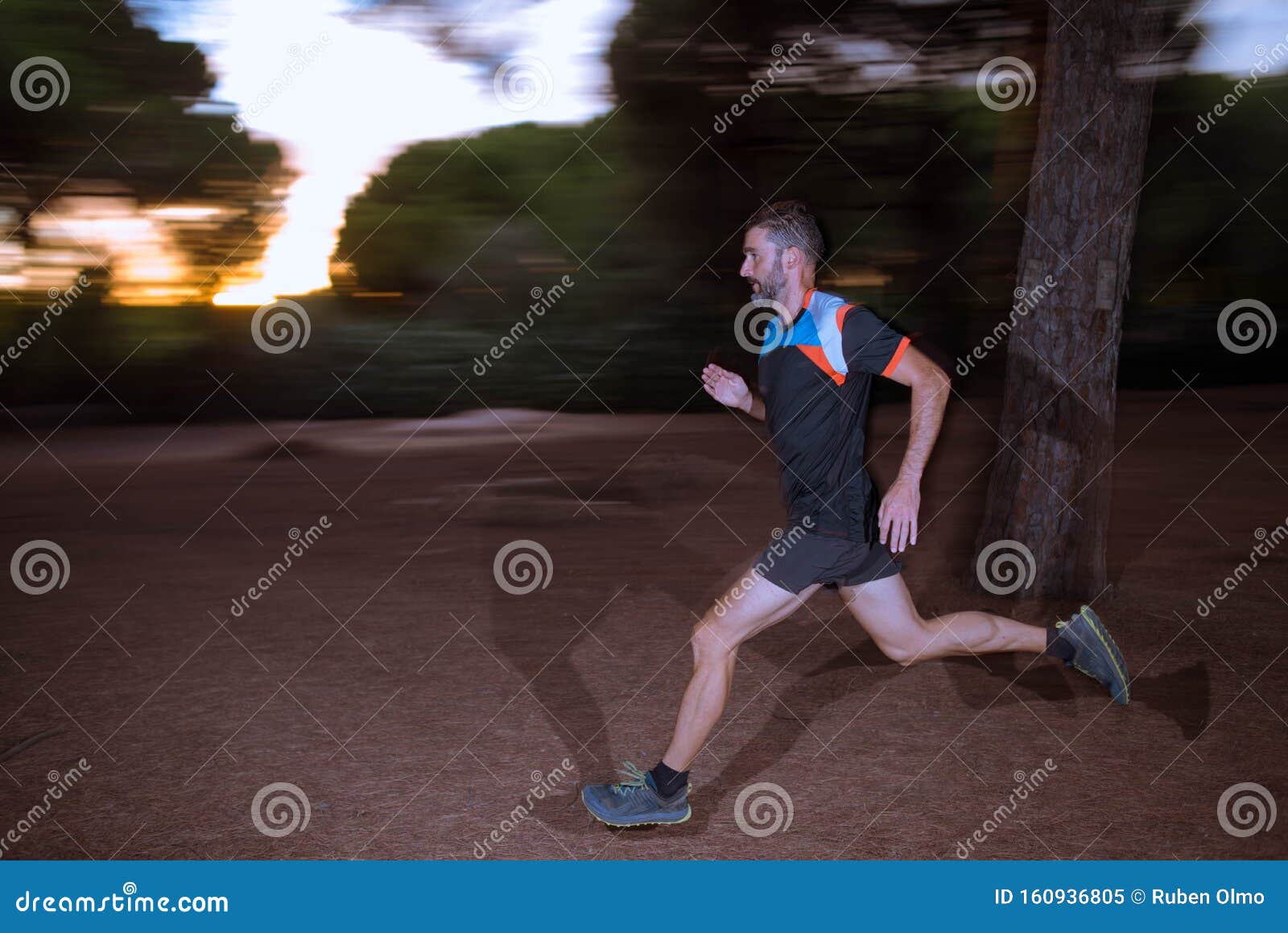 Middle Aged Caucasian Man Trail Runner Training Fast Speed in the ...