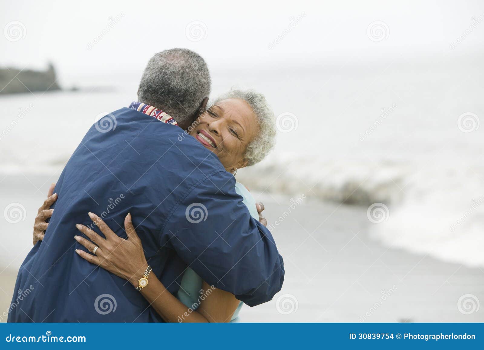 Middle-aged Couple Embracing at Beach Stock Photo - Image of emotions ...