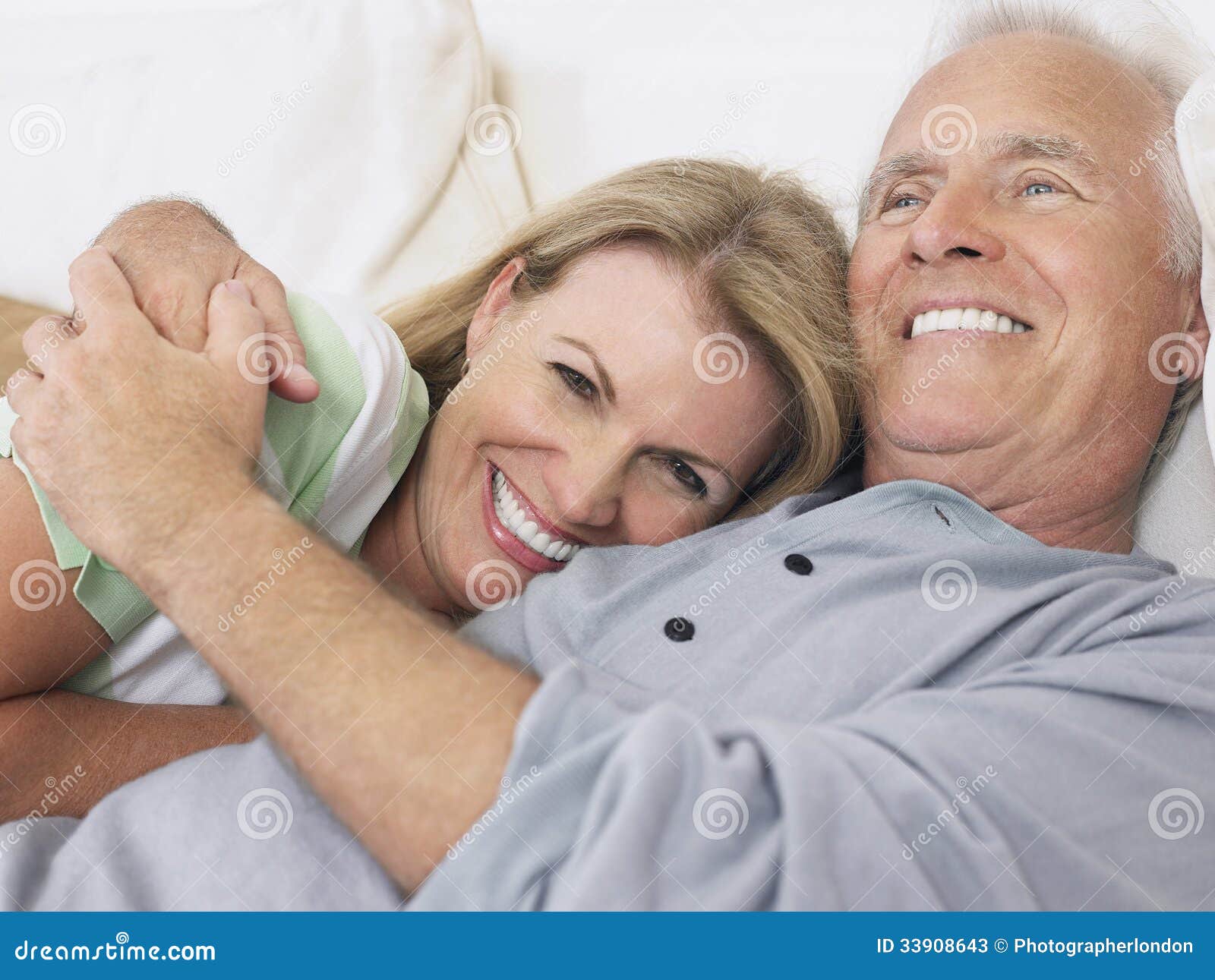 Middle Aged Couple Embracing in Bed Stock Image - Image of heterosexual ...