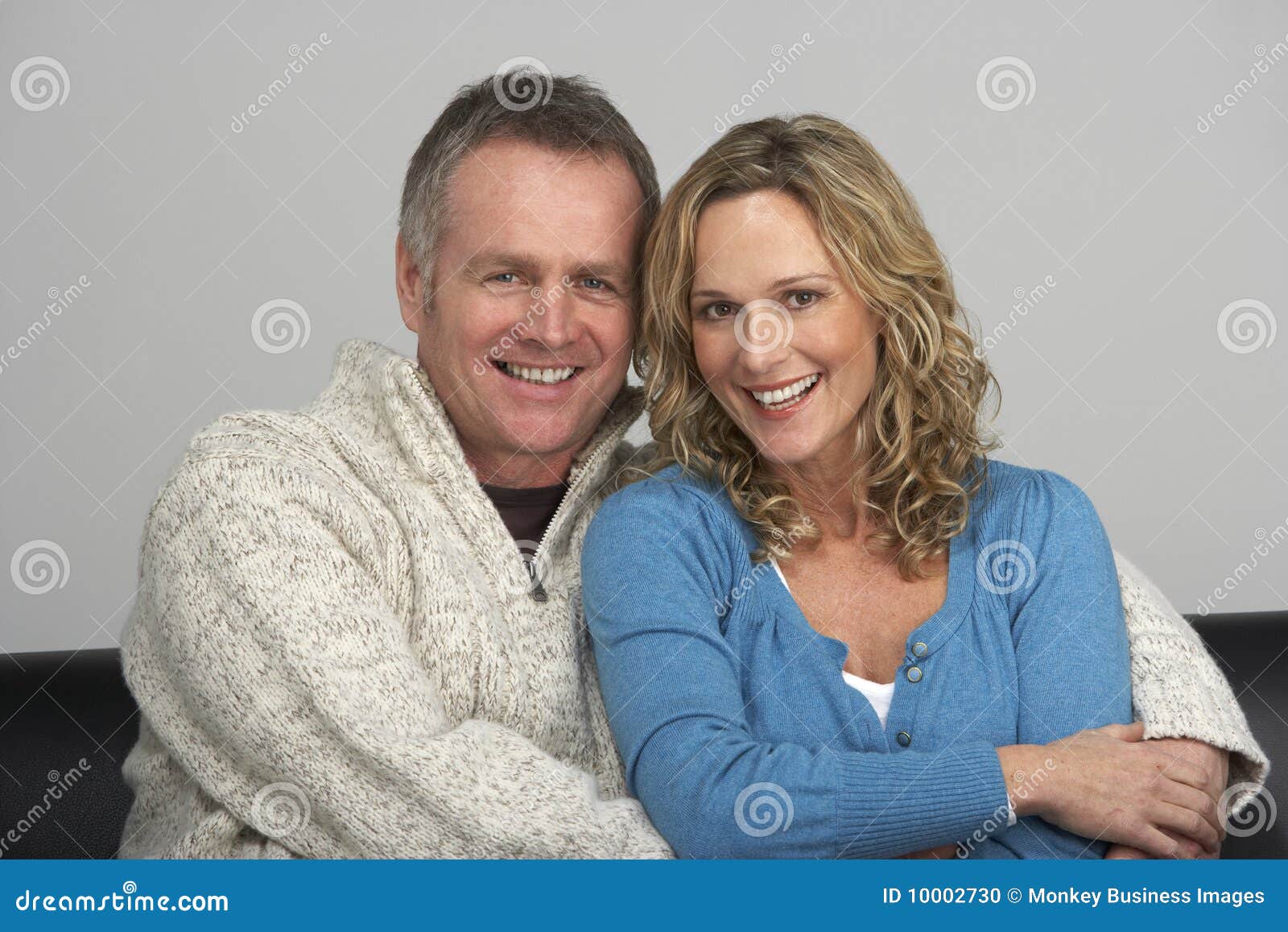 Middle Aged Couple Sitting On Sofa Royalty-Free Stock Image ...