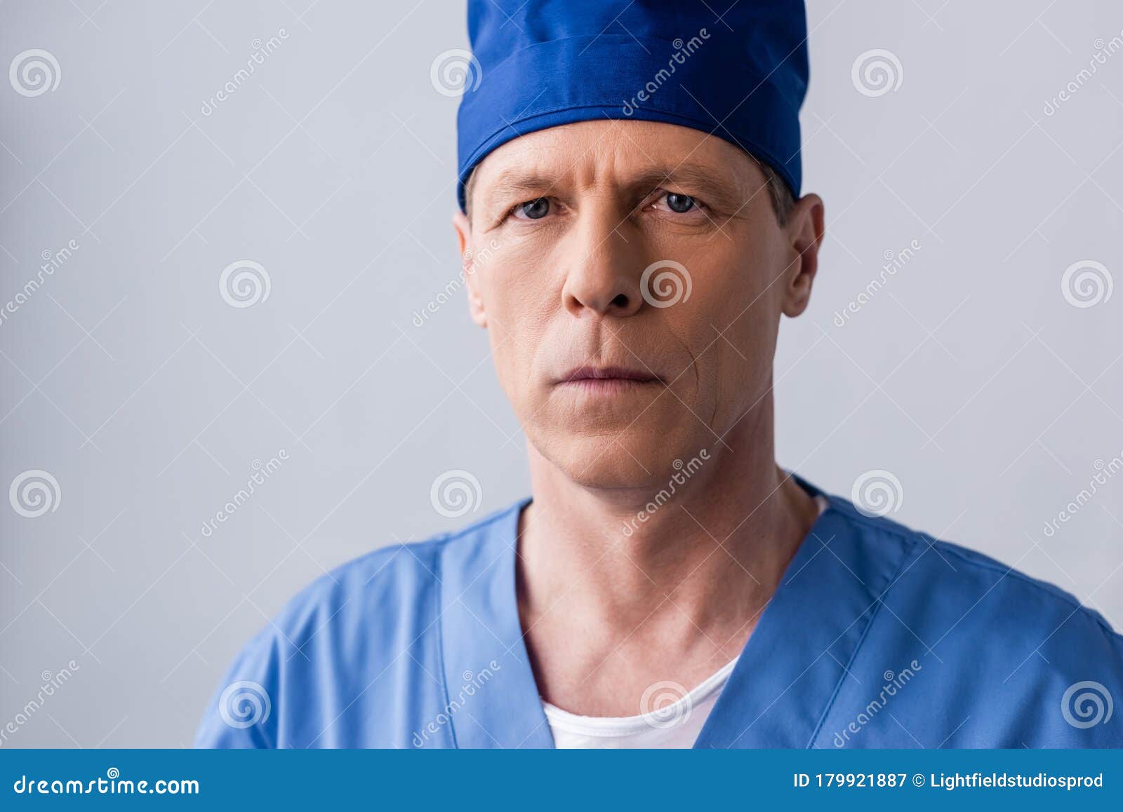 Middle Aged Doctor in Blue Scrub Hat Stock Image - Image of blue ...