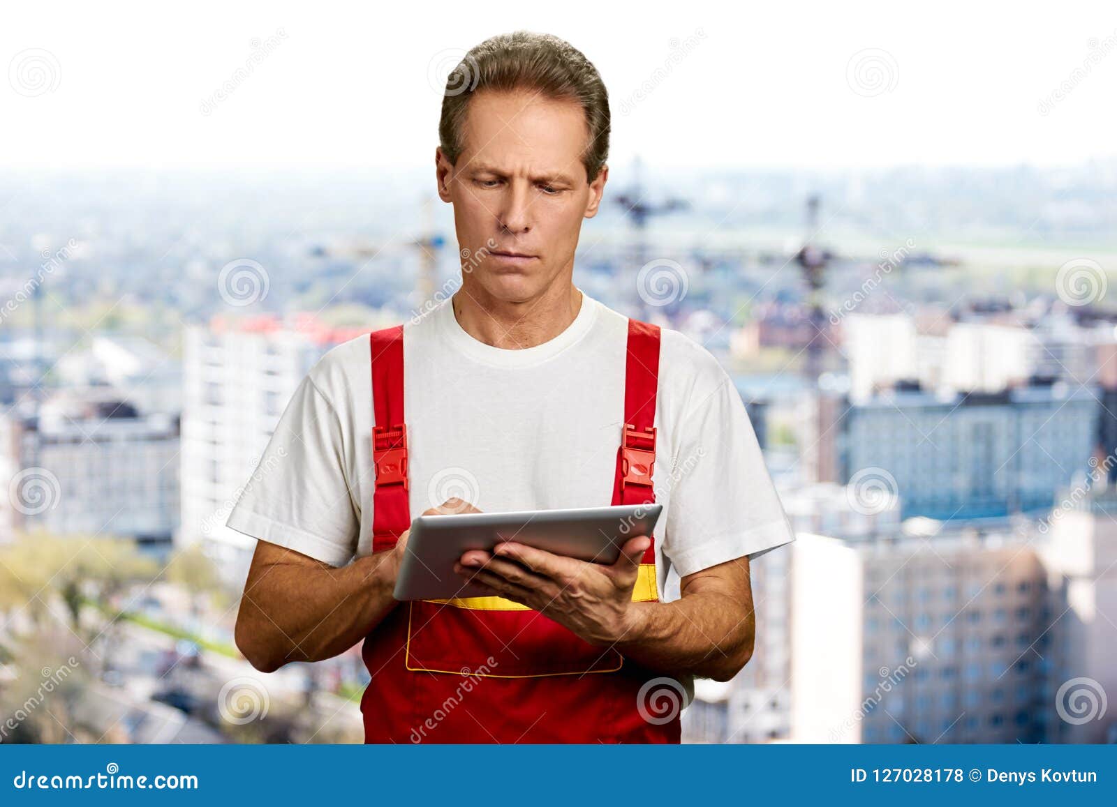 Middle Aged Engineer Using Digital Tablet. Stock Photo - Image of adult ...