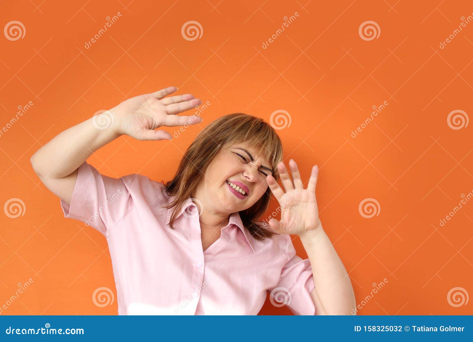 Middle-aged European Woman is Standing, Protestingly Extending Both ...