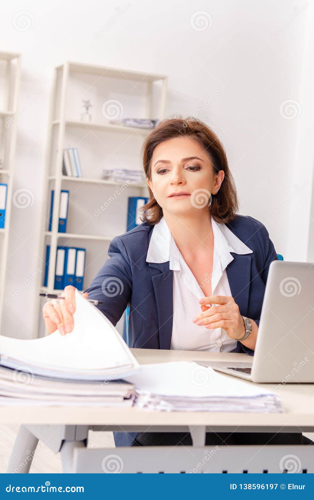 The Middle-aged Female Employee Sitting at the Office Stock Image ...
