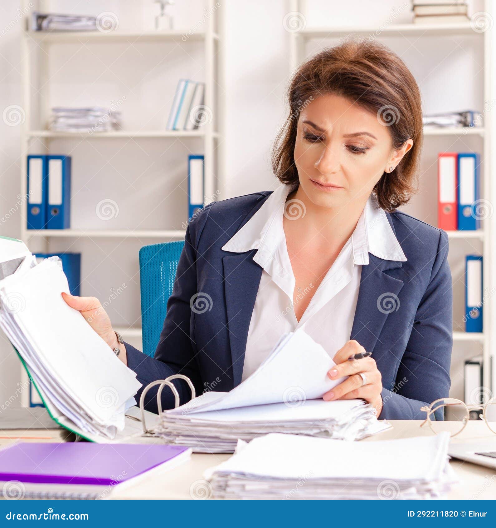 Middle-aged Female Employee Sitting at the Office Stock Photo - Image ...