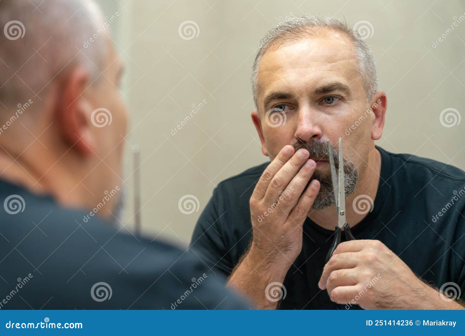 Middle-aged Handsome Man Using Scissors To Cut His Beard a Litlie and ...