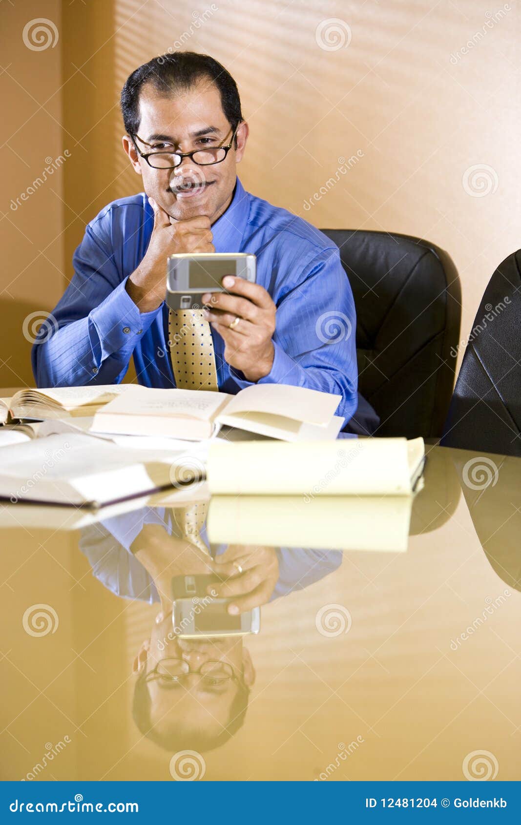 Middle-aged Hispanic Businessman Texting Stock Photo - Image of staring ...