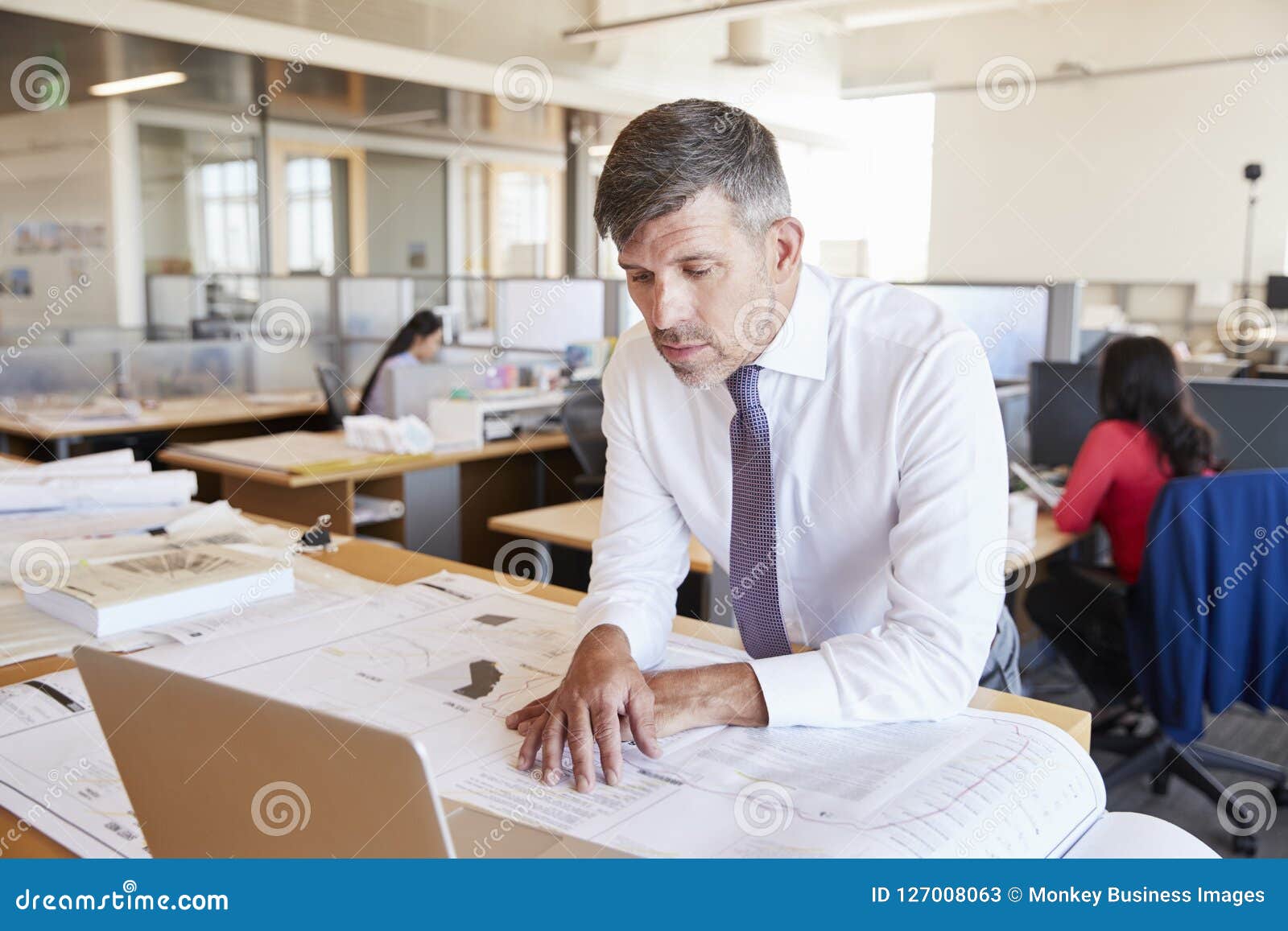 Middle Aged Male Architect Studying Plans in His Office Stock Image ...