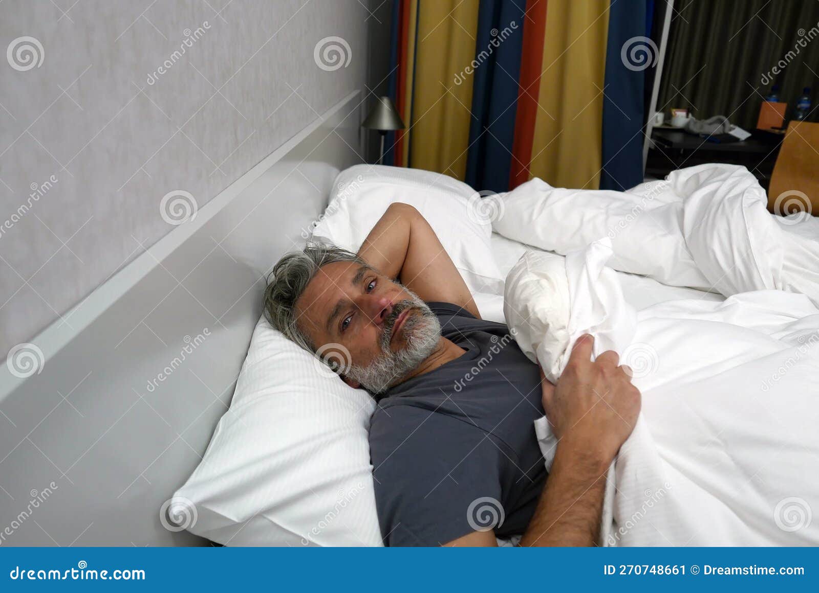 Middle aged man bed stock image. Image of concerned - 270748661