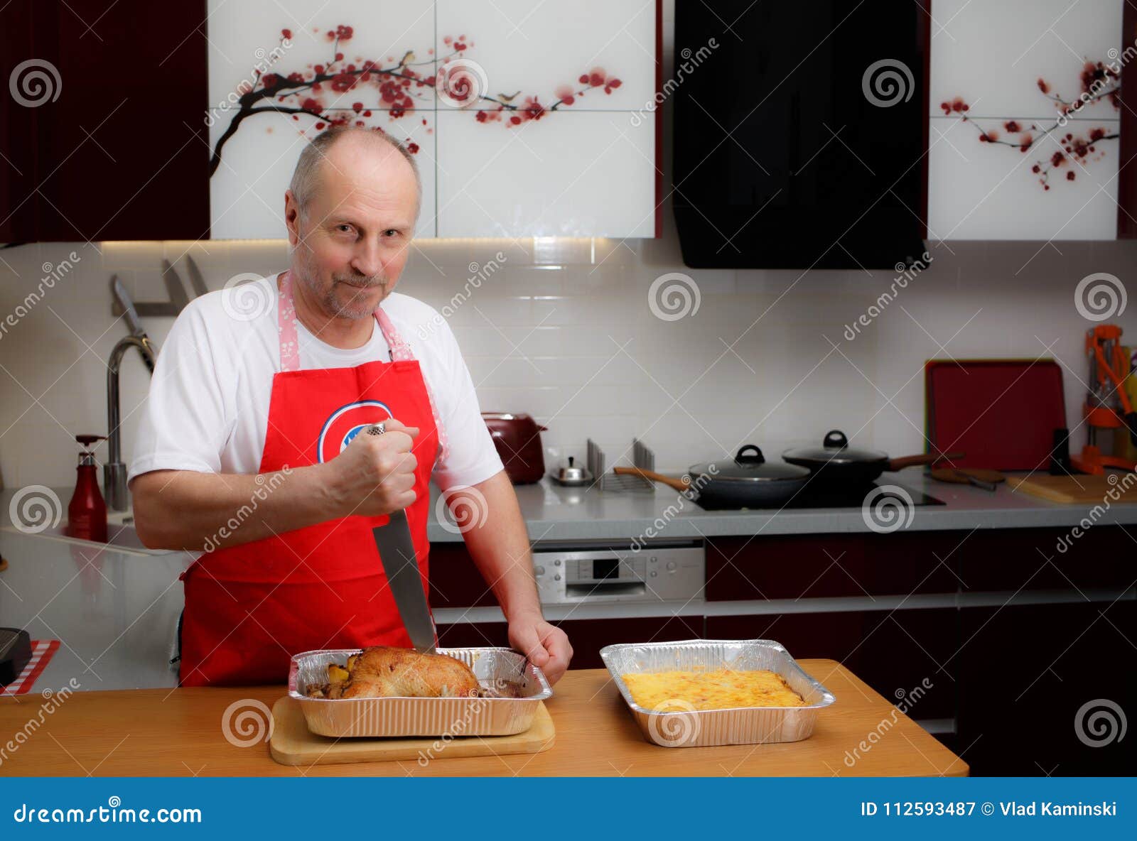 A Man is Cooking in the Kitchen Stock Image - Image of beard, cuisine ...