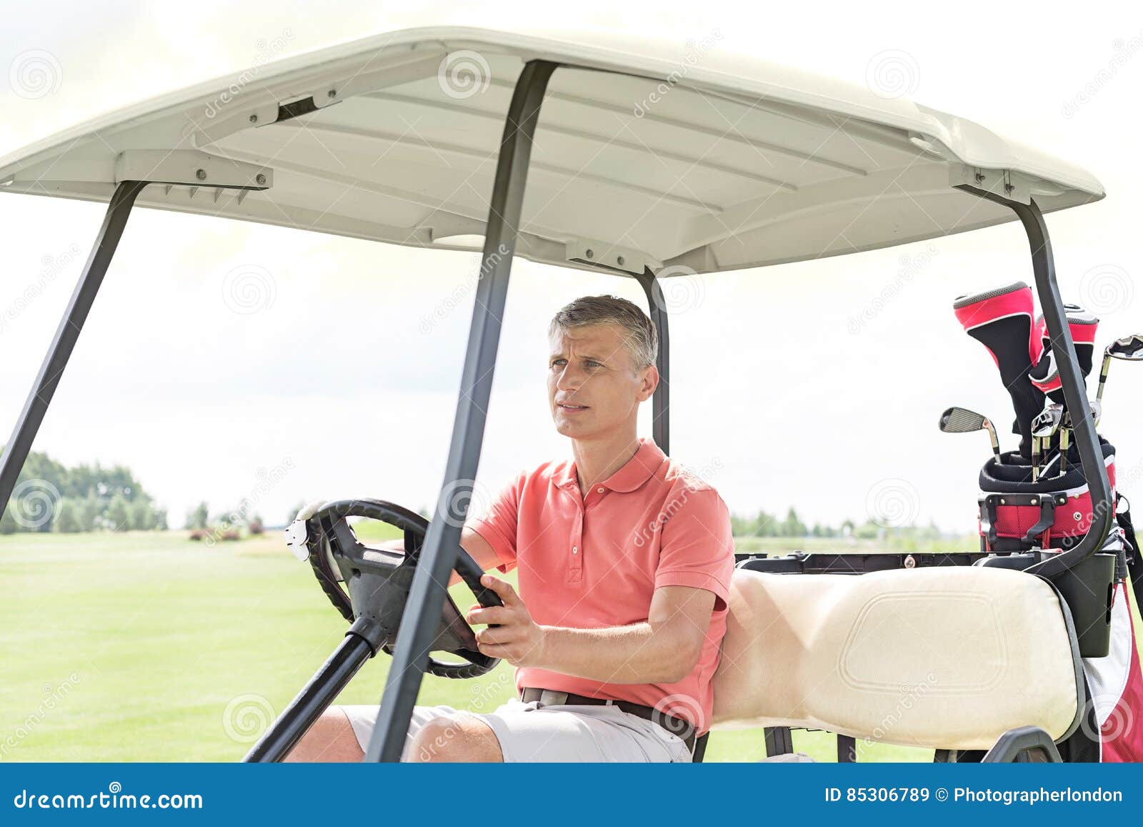 Middle-aged Man Driving Cart at Golf Course Stock Image - Image of male ...