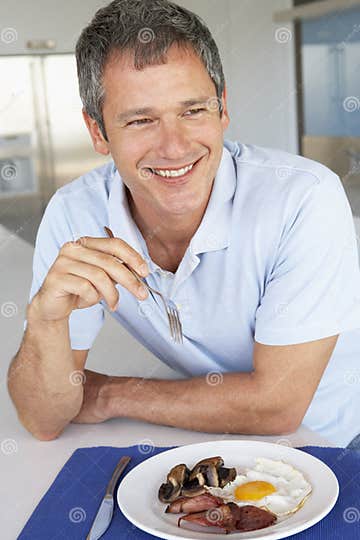 Middle Aged Man Eating Unhealthy Fried Breakfast Stock Photo - Image of ... Middle Aged Man Eating Unhealthy Fried Breakfast Stock Photo - Image of ...