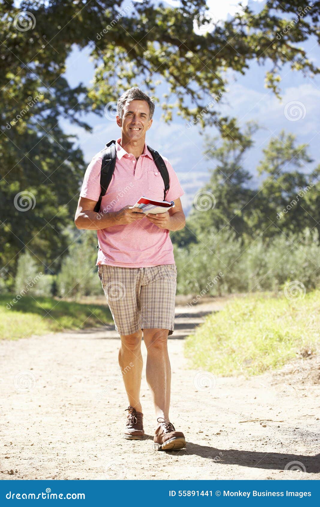 Middle Aged Man Hiking through Countryside Stock Image - Image of ...