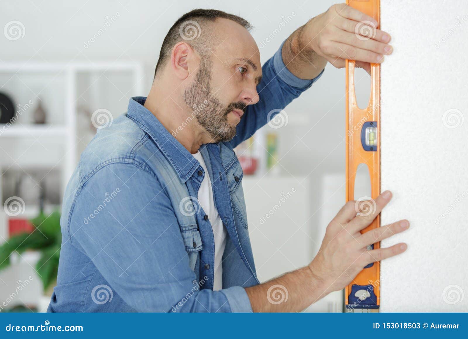 Middle Aged Man Leveling Wall Stock Image - Image of domestic ...