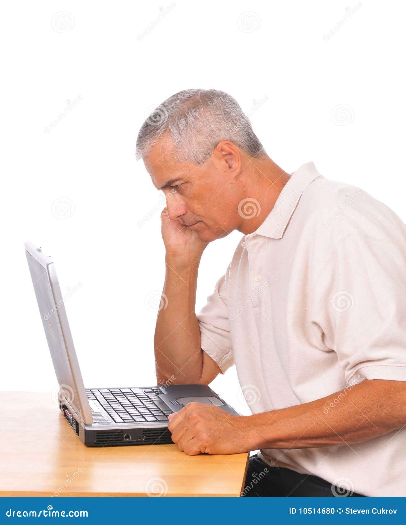 Middle Aged Man Looking Intently at Laptop Stock Photo - Image of ...