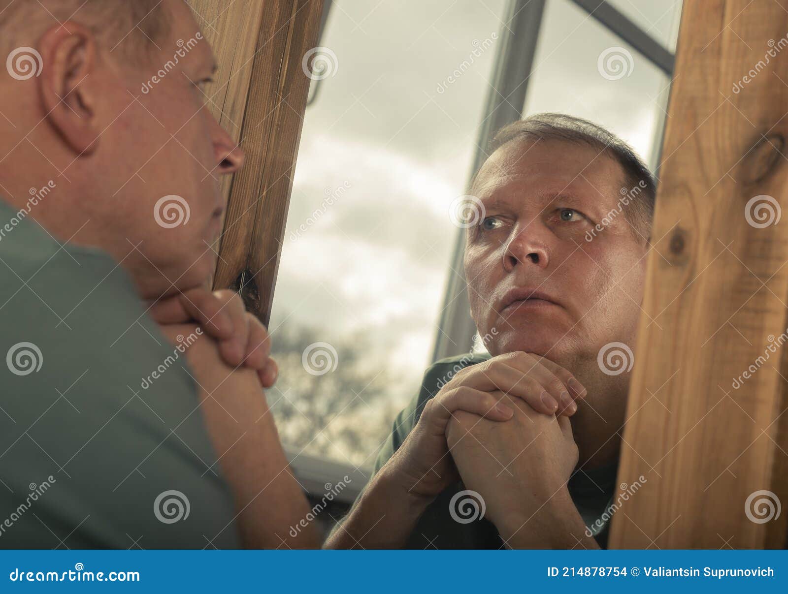 Middle-aged Man Looking at Mirror Reflection Seriously, Thinking about ...