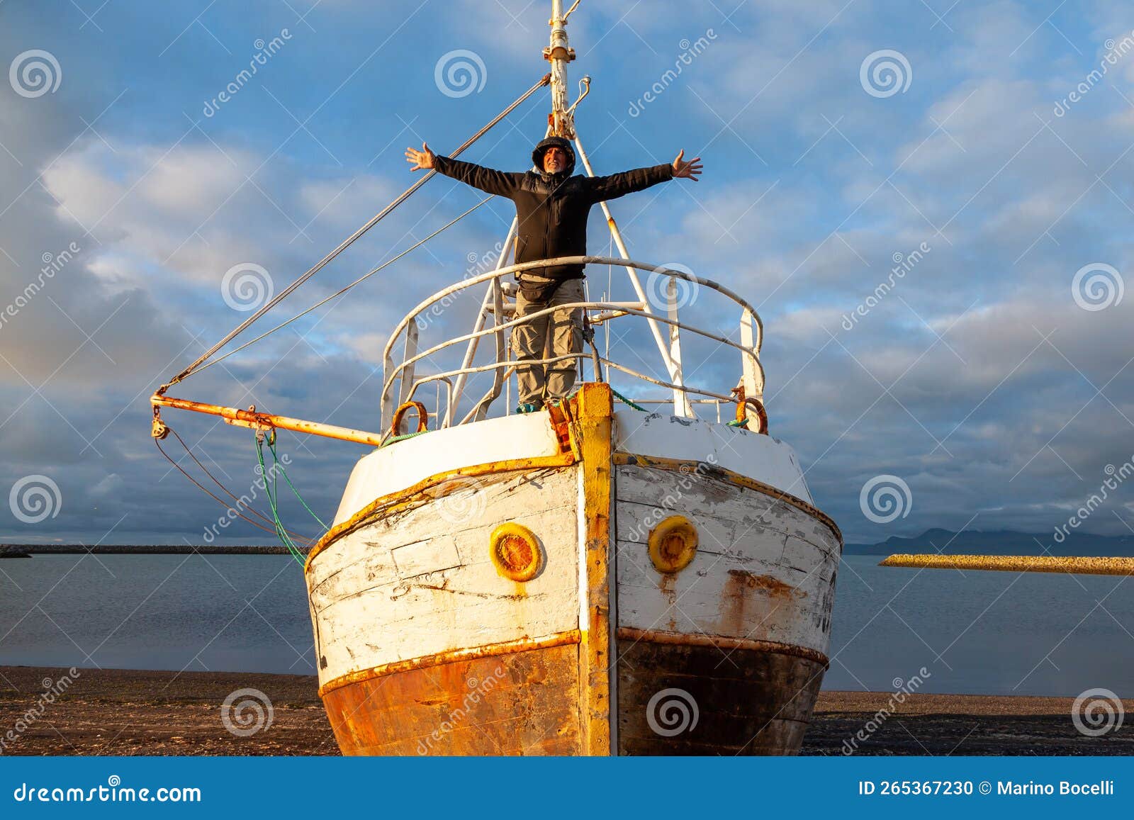Middle-aged Man Playing Captain on a Boat Stranded on an Icelandic ...