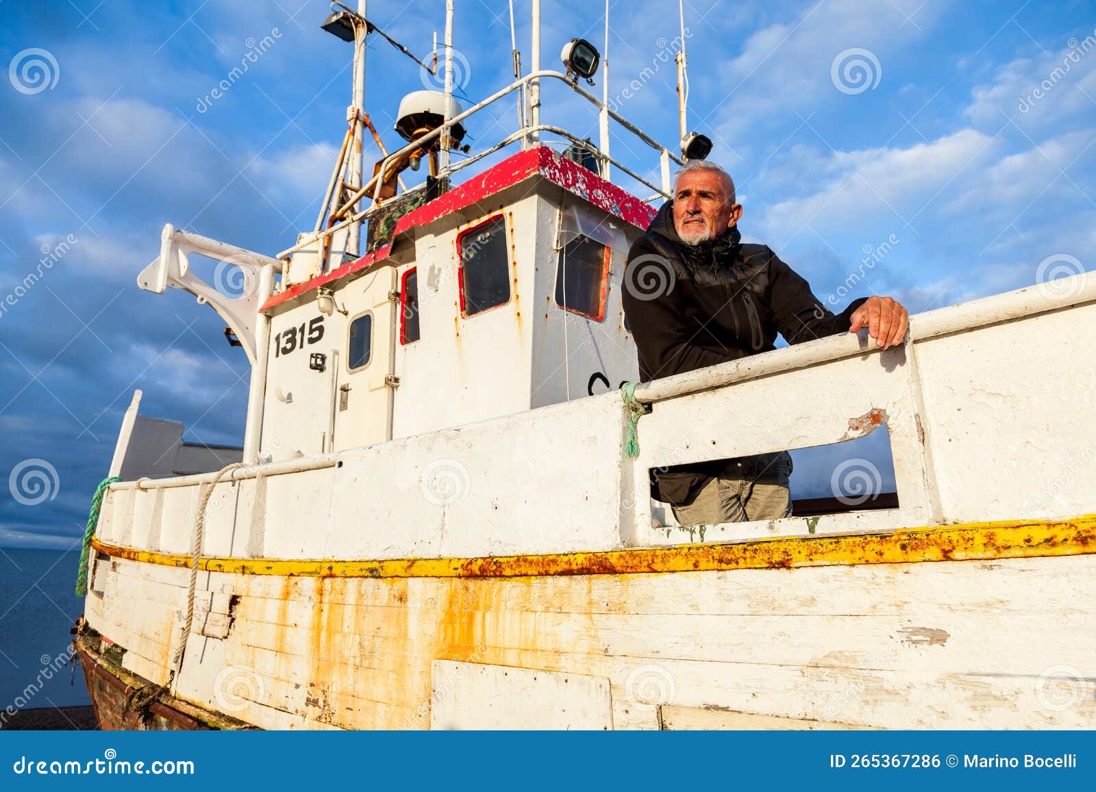 Middle-aged Man Playing Captain on a Boat Stranded on an Icelandic ...
