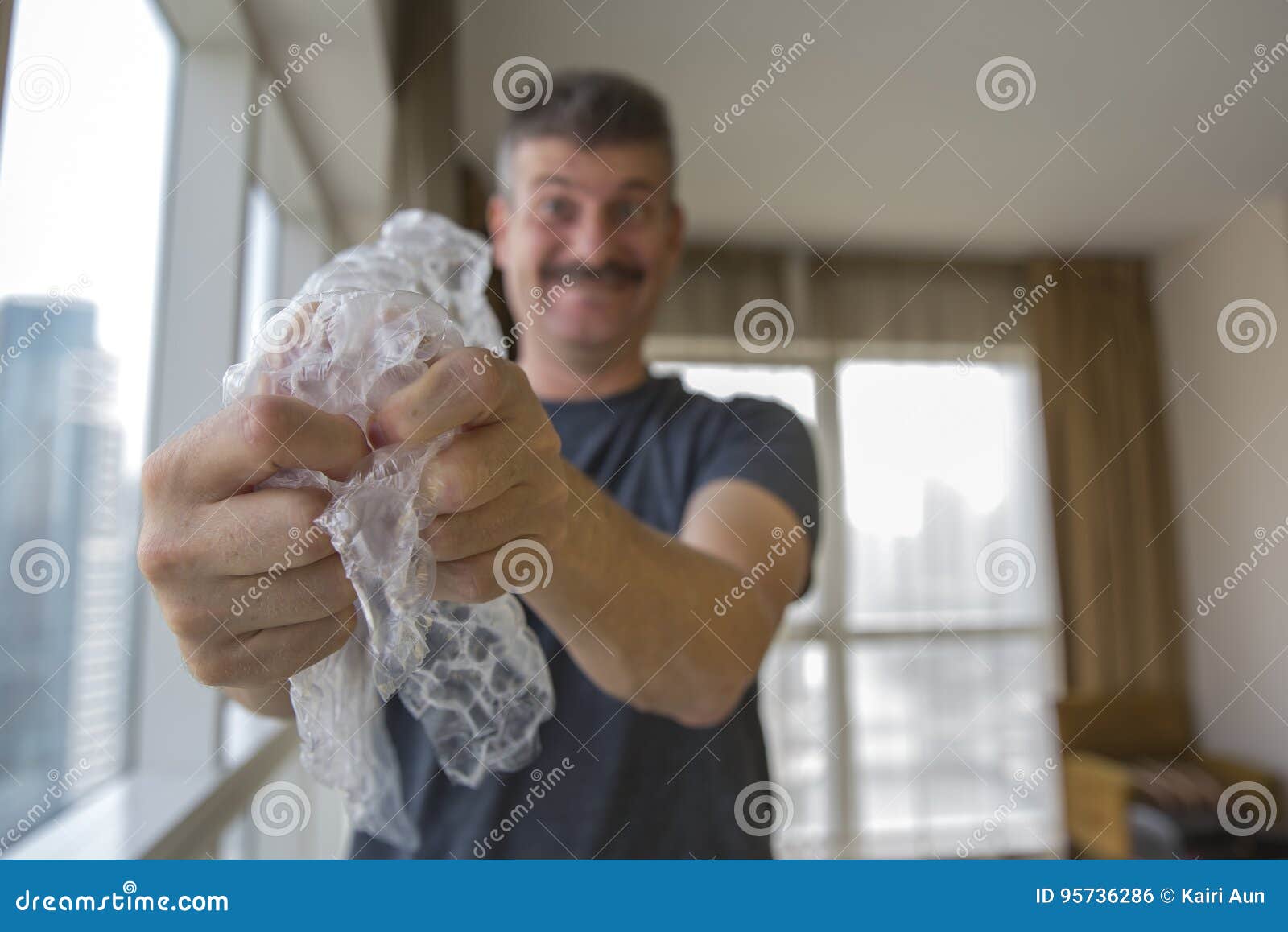 Middle Aged Man Popping Bubble Wrap Stock Photo - Image of arab, cool ...