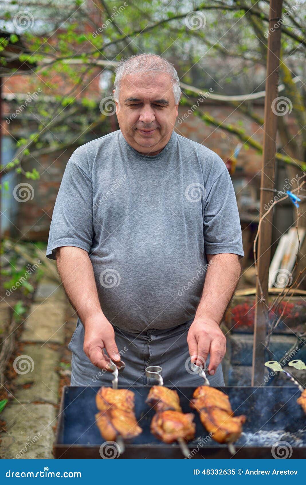 Middle-aged Man Preparing Barbecue Stock Image - Image of picnic, meat ...
