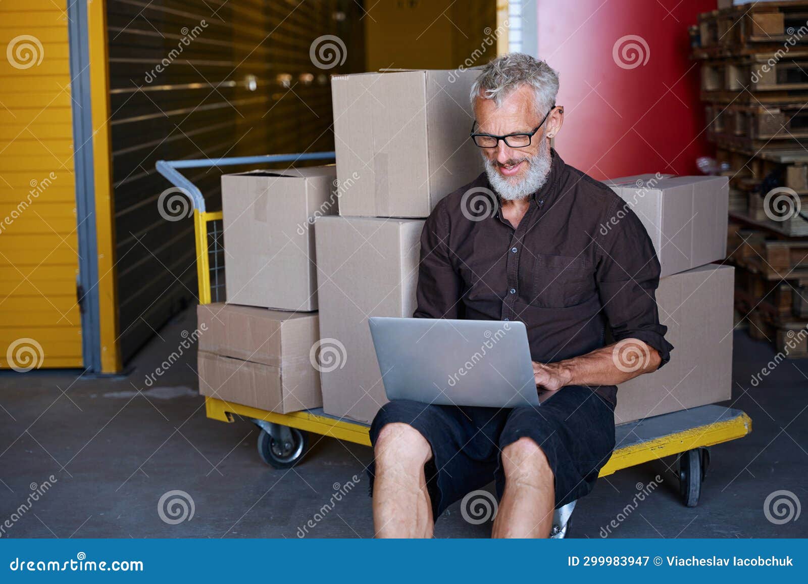 Middle-aged Man Sat Down on a Cart with Boxes Stock Image - Image of ...