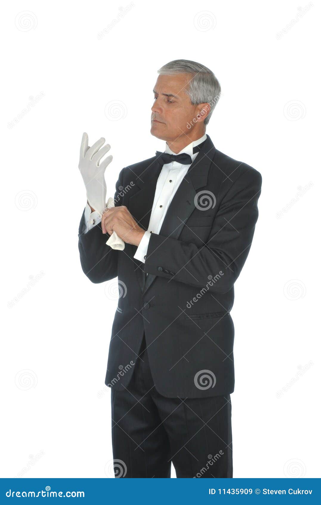 Middle Aged Man in Tux Putting on White Gloves Stock Image - Image of ...