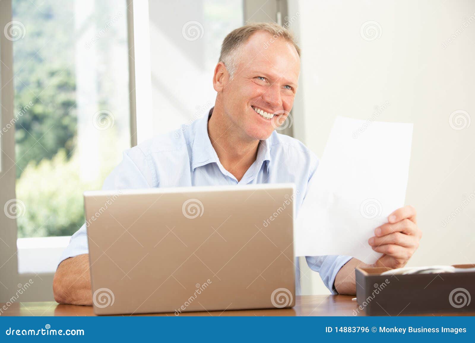 Middle Aged Man Using Laptop at Home Stock Photo - Image of computer ...