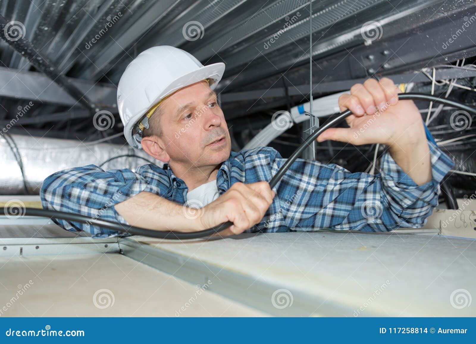 Middle-aged Man Worker Working in Ceiling Stock Photo - Image of power ...